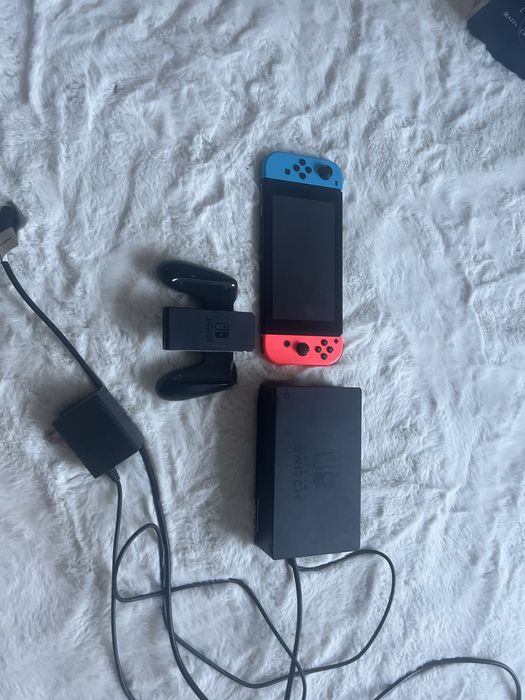 Nintendo Switch red and blue with a controller гр. София Кръстова вада ...