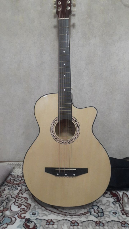 Yangi gitara biron marta ishlatilmagan kelishamiz