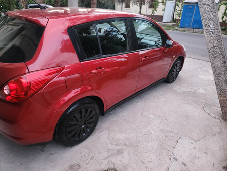 Nissan tiida 2009 год