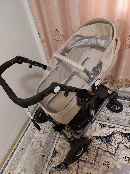 Детская коляска с зимним и летним удобством