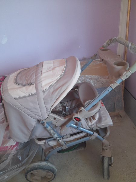 Продам коляску и ходунок