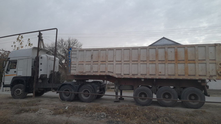Тягач самосвал howo A6 60t zavodskoy metan