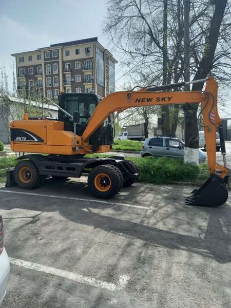 Экскаватори .погрузчик