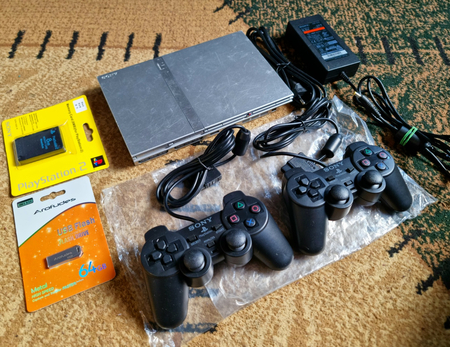 Playstation 2 slim kulrang