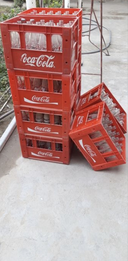 Coca cola yashik butilkasi bilan