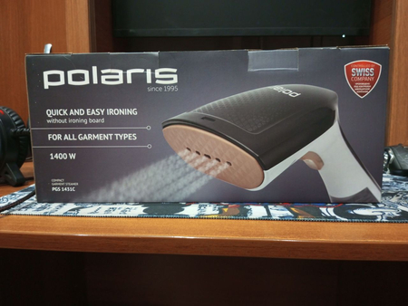 Паровой утюг Polaris.