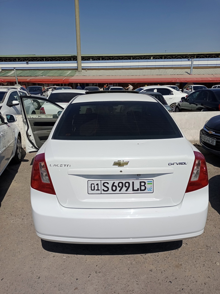 Laseti  Chevrolet 2013 yil xolati alo  avtomat  139ming yurgani halol
