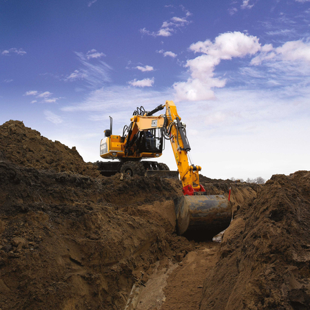 Английский колесный экскаватор JCB JS 160W