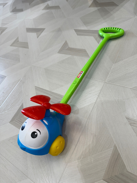 Игрушка каталка вертолет