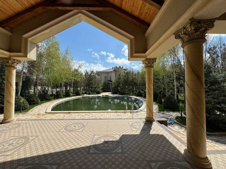 Продажа загородного дома 48 соток в Кибрае в элитном поселке