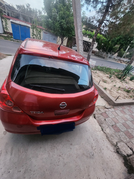 Nissan tiida 2009 год